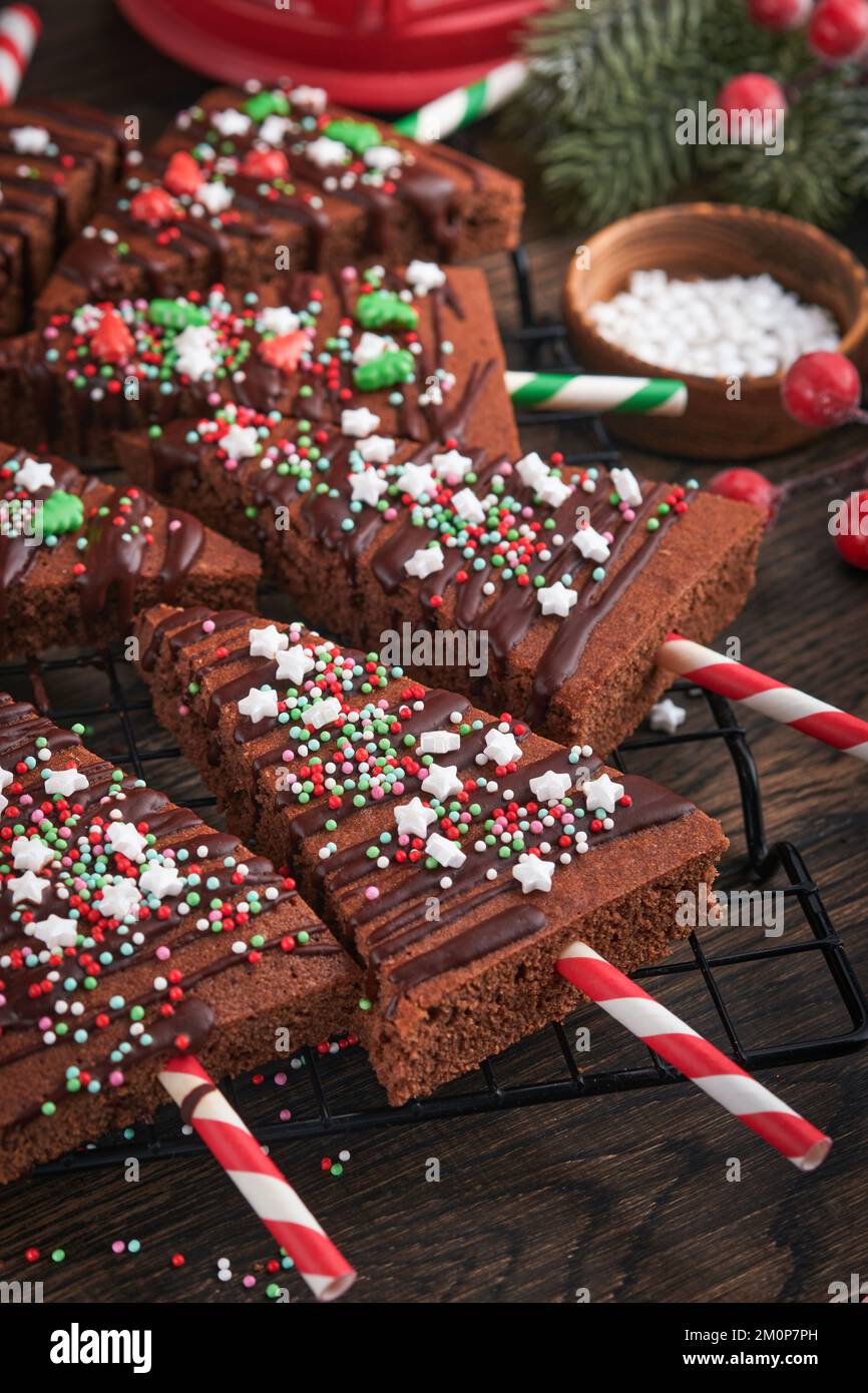 Chocolate brownies Christmas tree with chocolate icing and festive ...