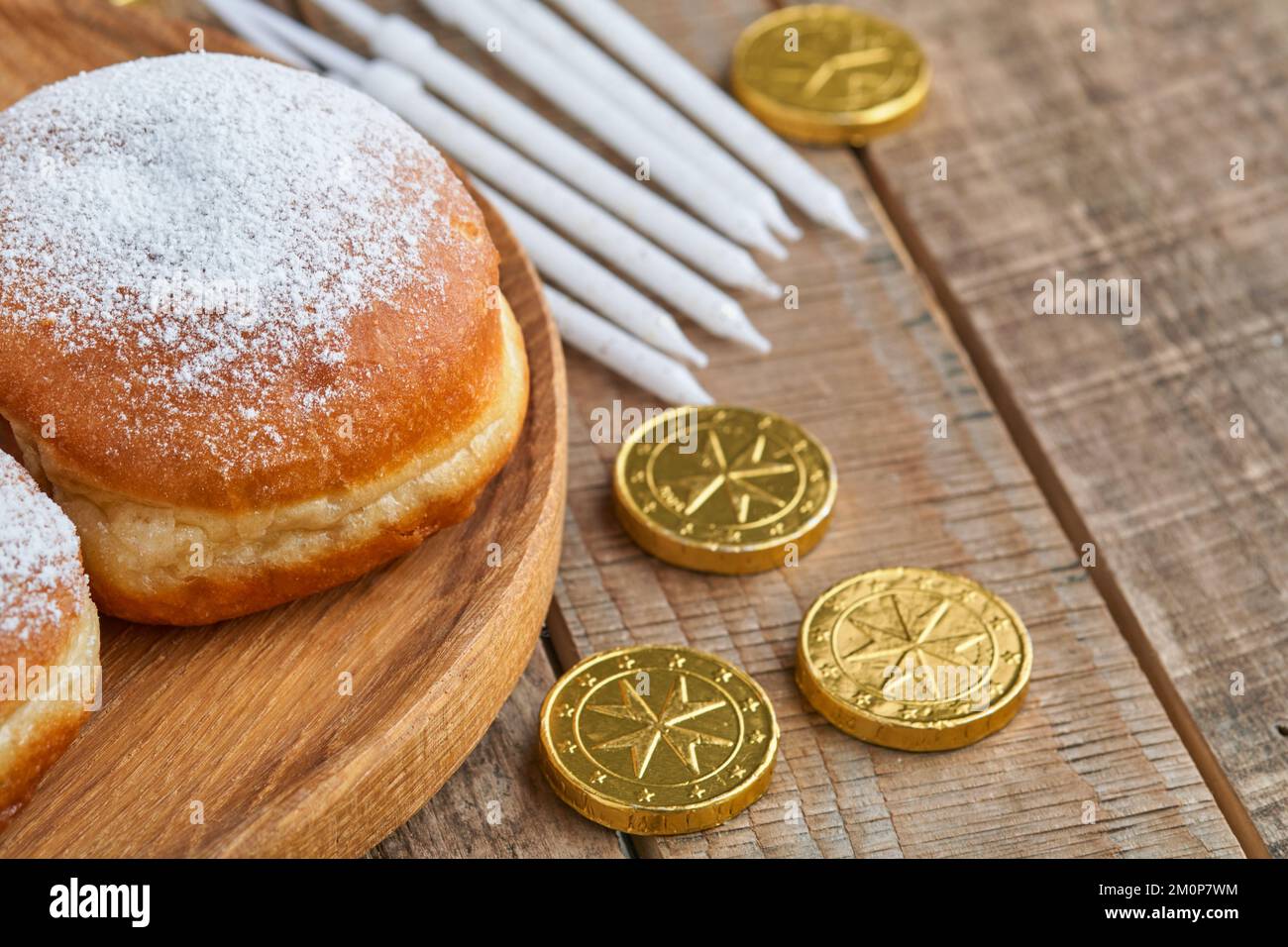 Happy Hanukkah. Hanukkah sweet doughnuts, gift boxes, white candles and ...