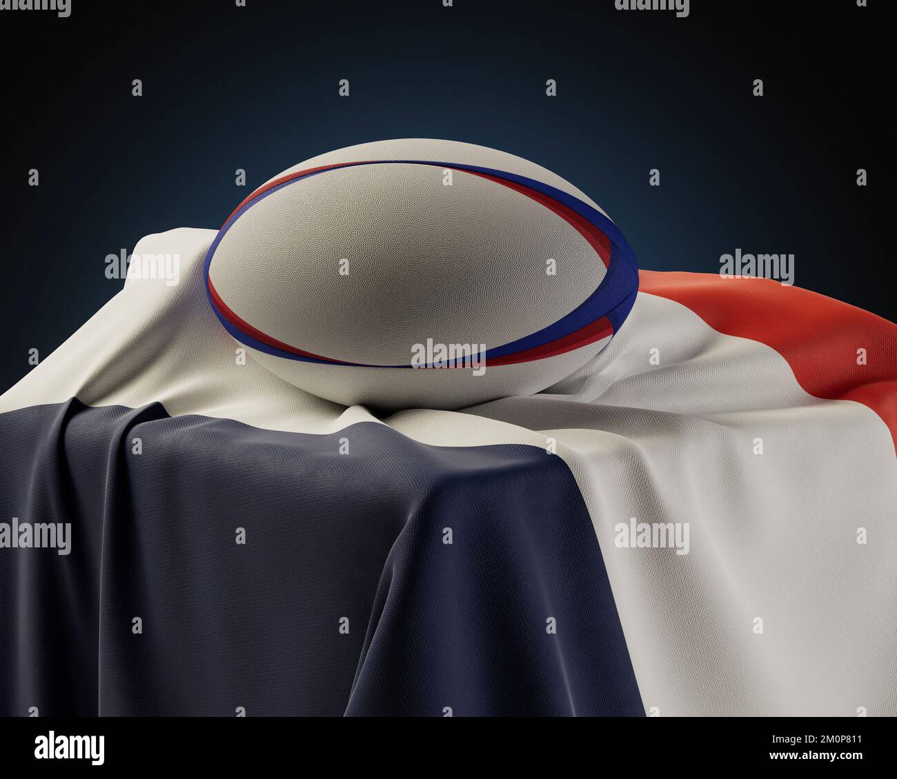 A regular rugby ball resting on a France flag draped over a plinth on ...