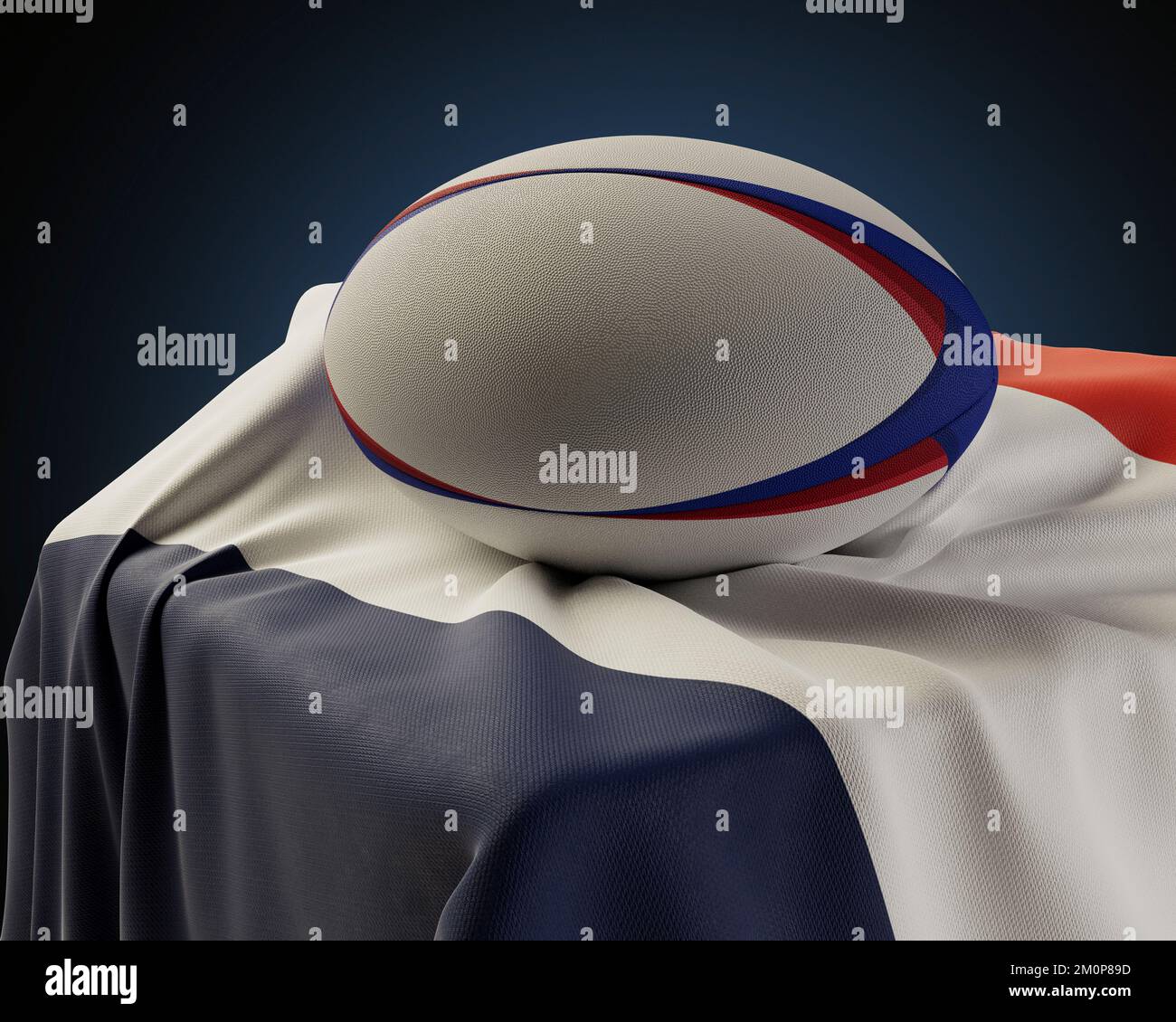 A regular rugby ball resting on a France flag draped over a plinth on ...