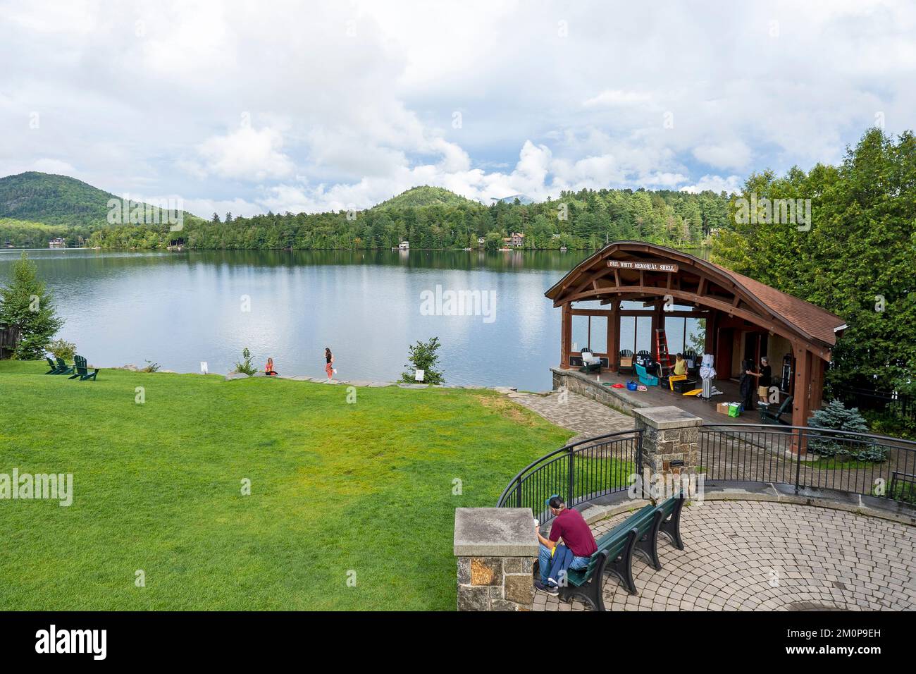 Tourists on lawn in front of Mirror Lake, view of the the Paul White ...