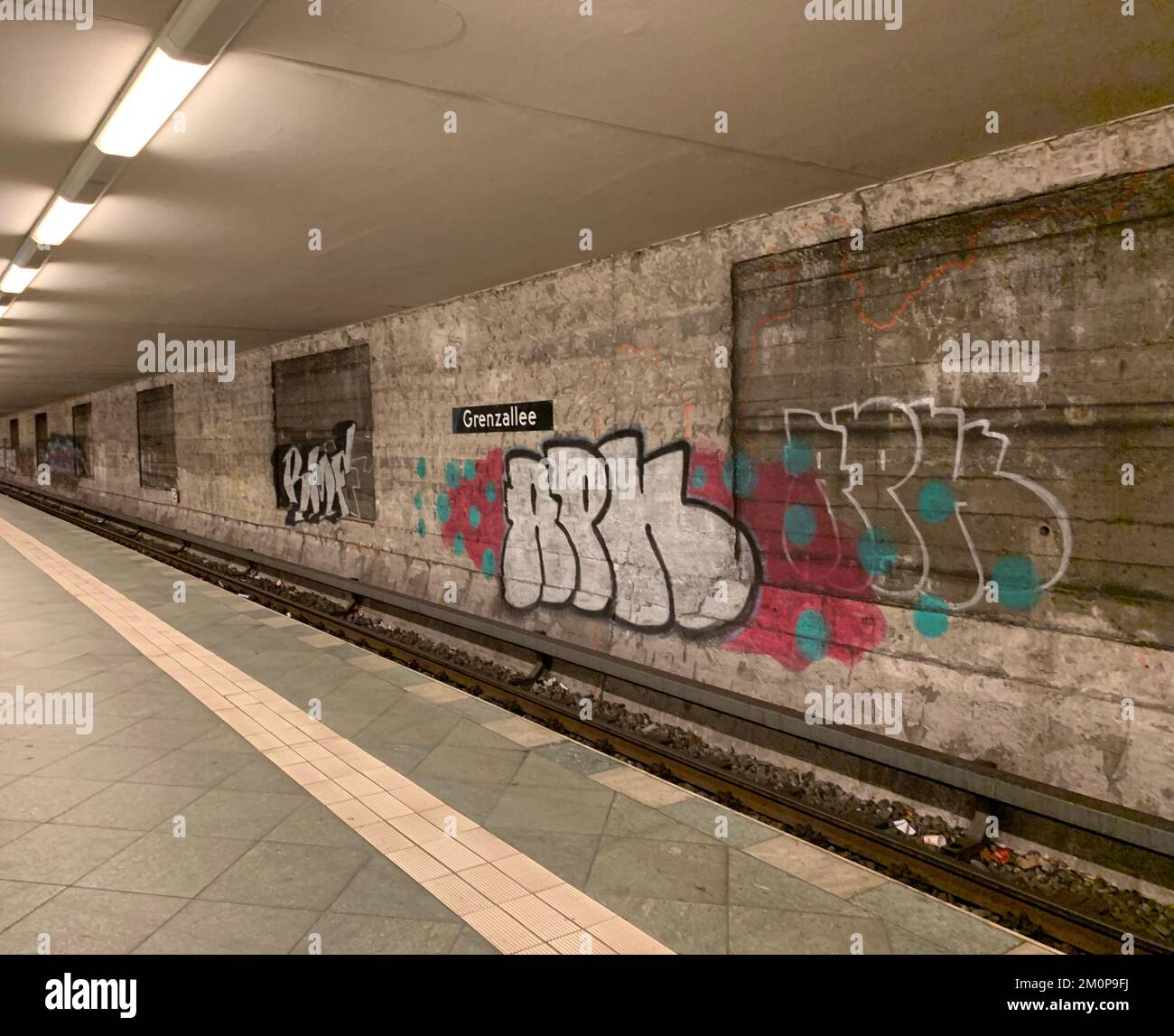 A subway station in Berlin, Germany with the wall beside the rails ...