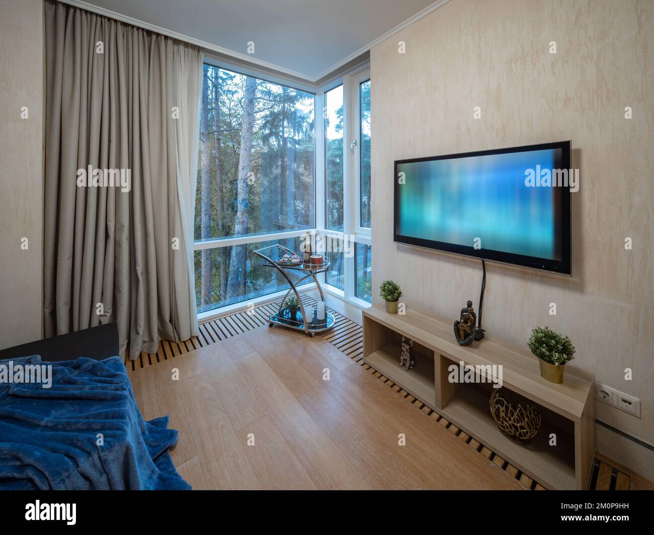 Modern interior of living room. TV on wall. Panorama windows Stock ...