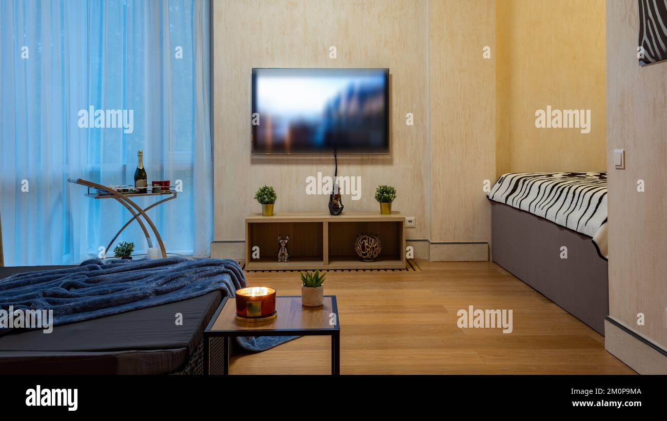 Modern interior of living room. TV on wall. Panorama windows Stock ...