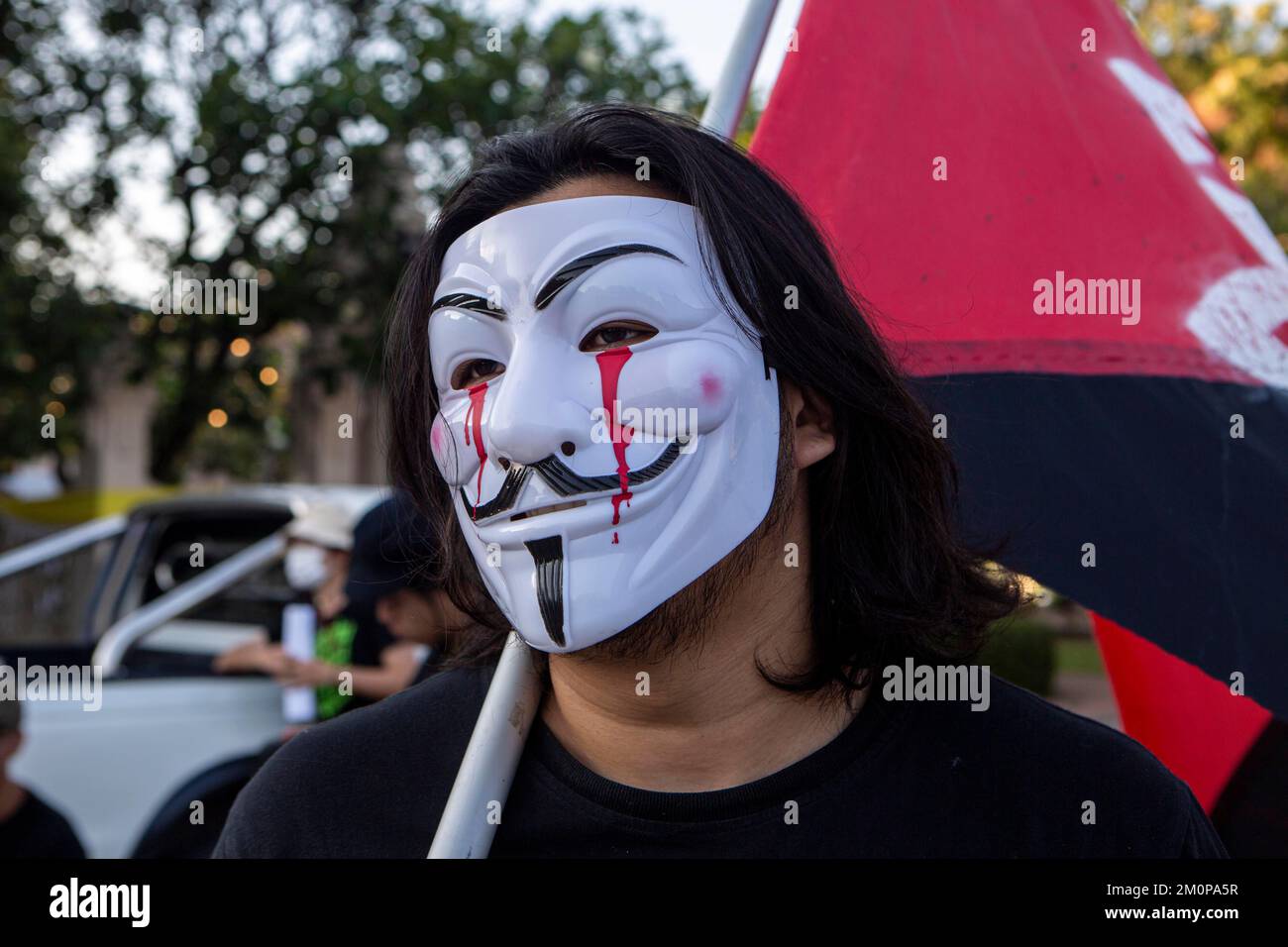 Chiang Mai, Thailand. 6th Dec, 2022. A protester wearing anonymous Guy ...