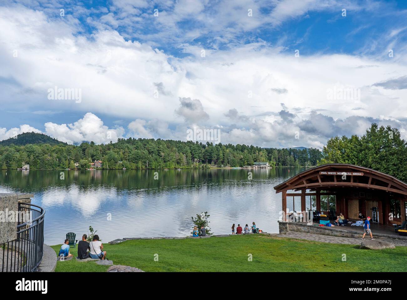 Tourists on lawn in front of Mirror Lake, view of the the Paul White ...