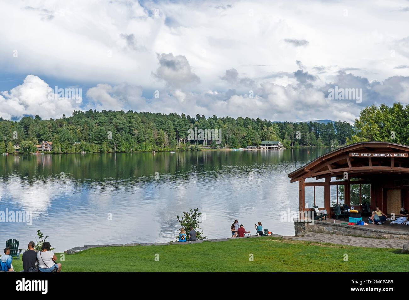 Tourists on lawn in front of Mirror Lake, view of the the Paul White ...
