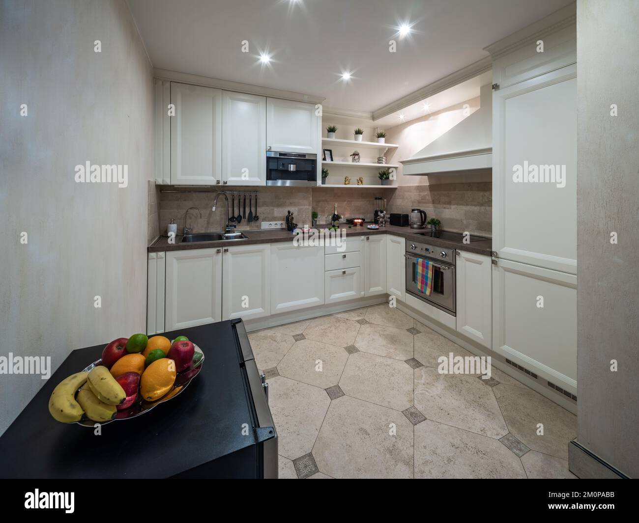 Modern interior of private house. Spacious kitchen. Fresh fruits Stock ...