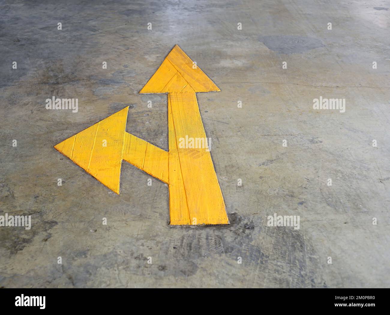 The yellow arrow symbol on the park building Stock Photo - Alamy
