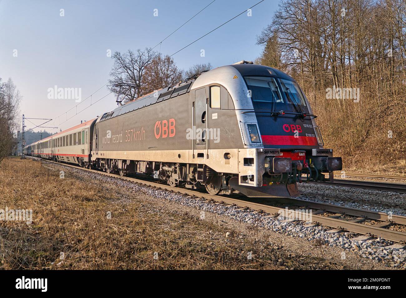 A Eurocity pulled through Assling by an OEBB class 1216 electric locomotive Stock Photo - Alamy