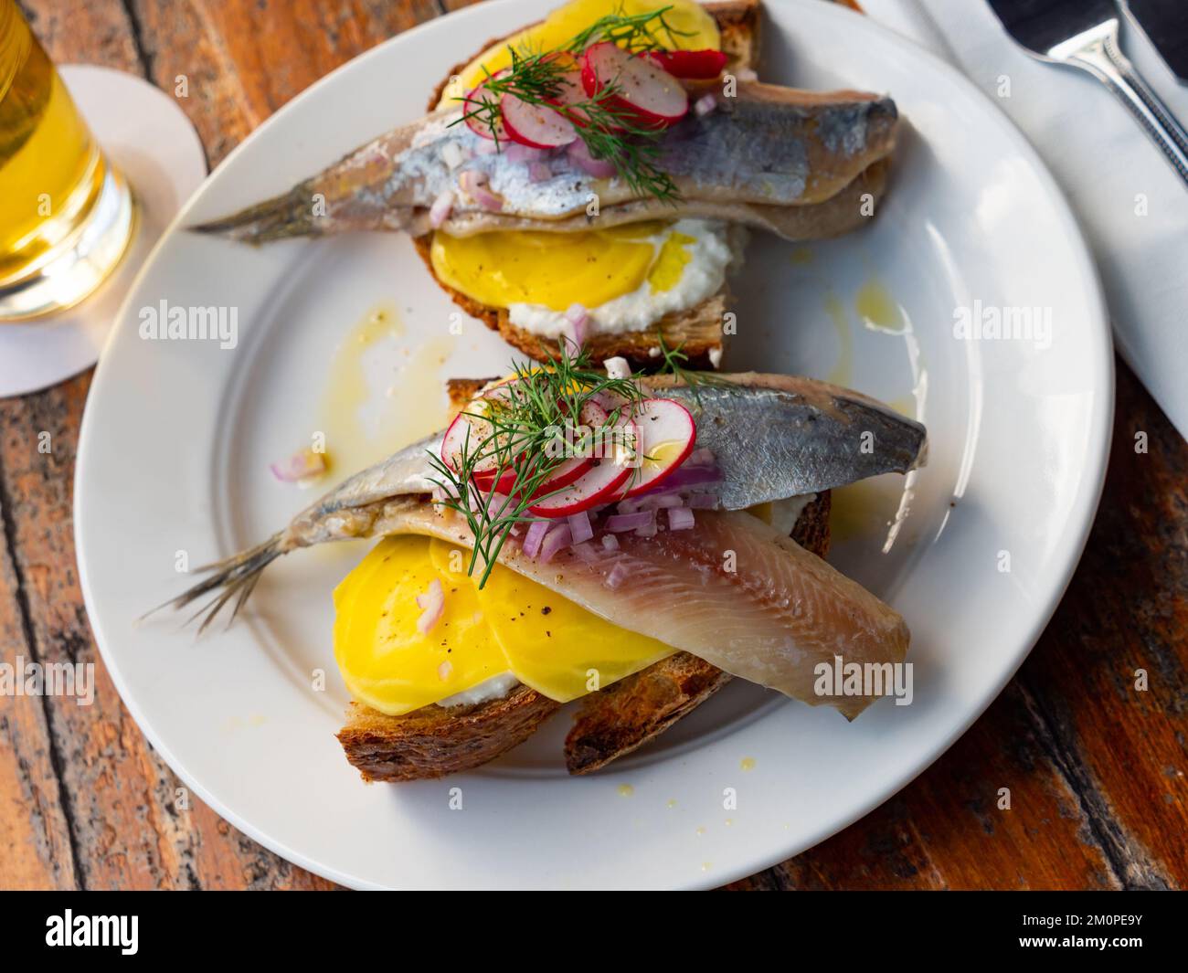 Traditional Dutch herring served on table in diner Stock Photo - Alamy