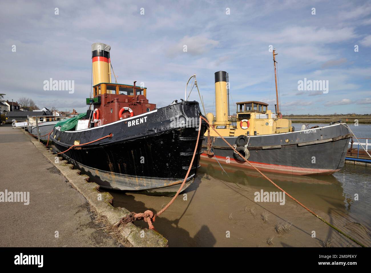 vintage tug boats moored in mud berths maldon essex england at low tide ...