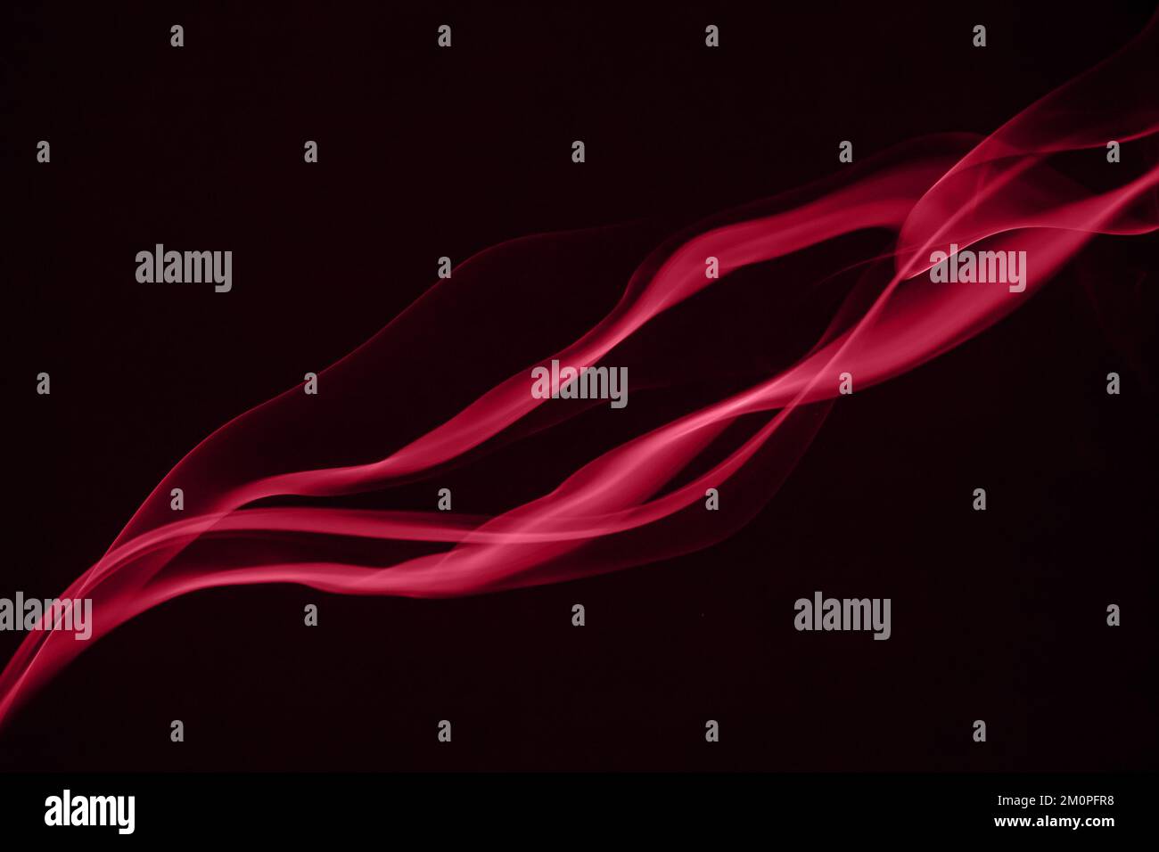 Red puffs of smoke on a black background. Color of the year 2023 - Viva ...