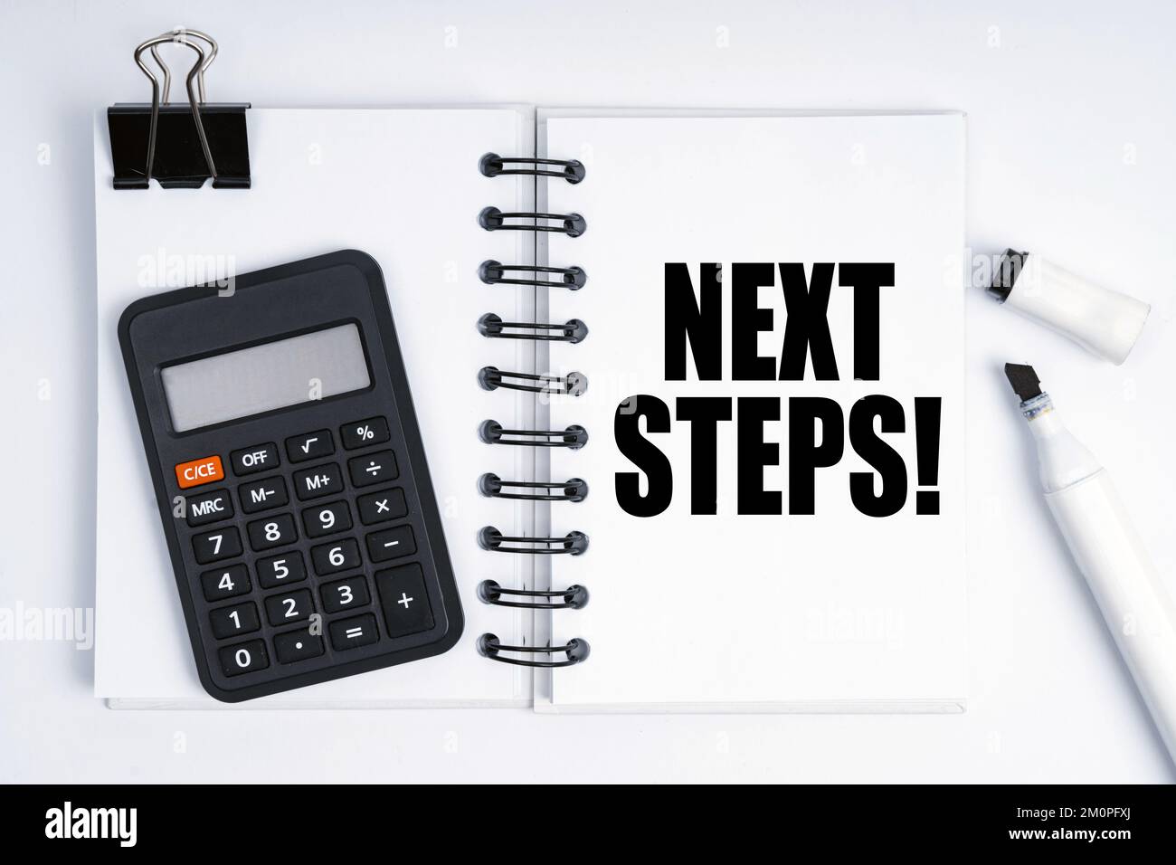 Economy and finance concept. On the table are a marker, a calculator ...