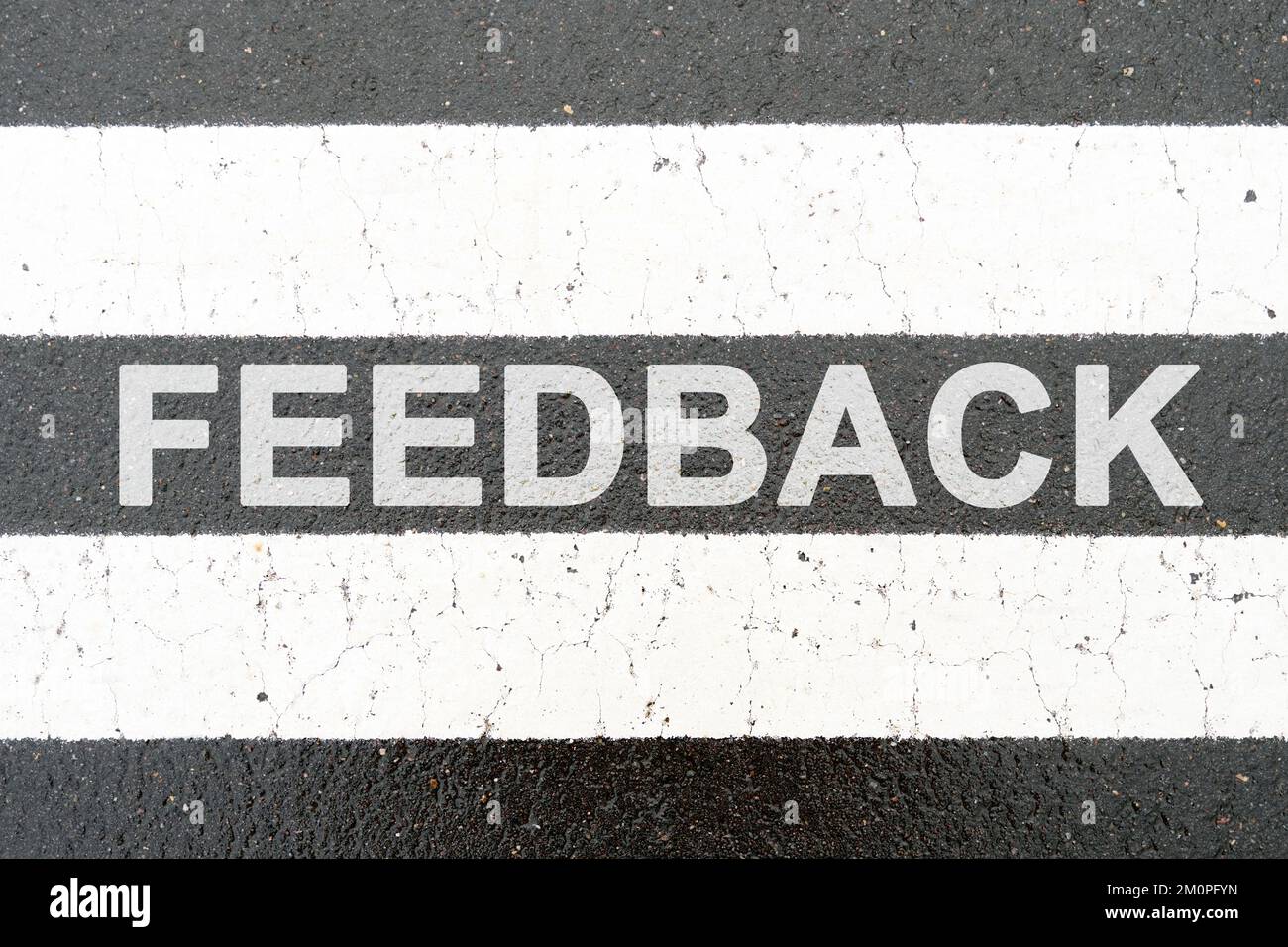 Business and finance concept. On the asphalt between the white dividing ...