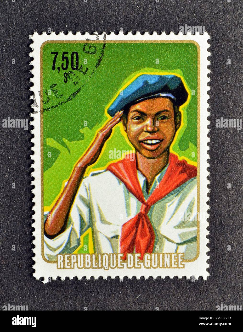 Cancelled postage stamp printed by Guinea, that shows Boy saluting ...