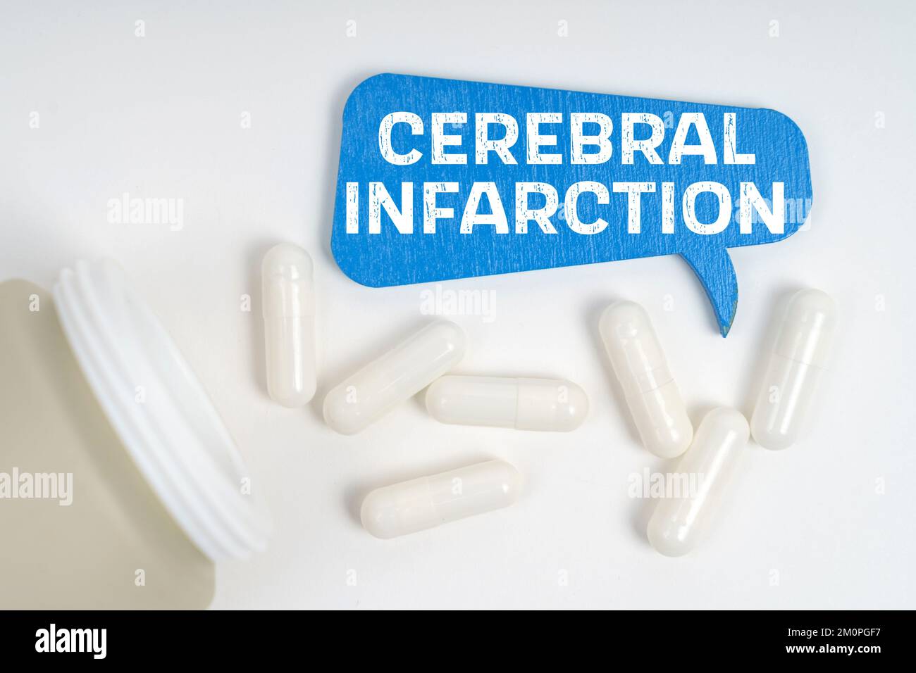 Medicine and health concept. On the table are pills and a blue sign ...