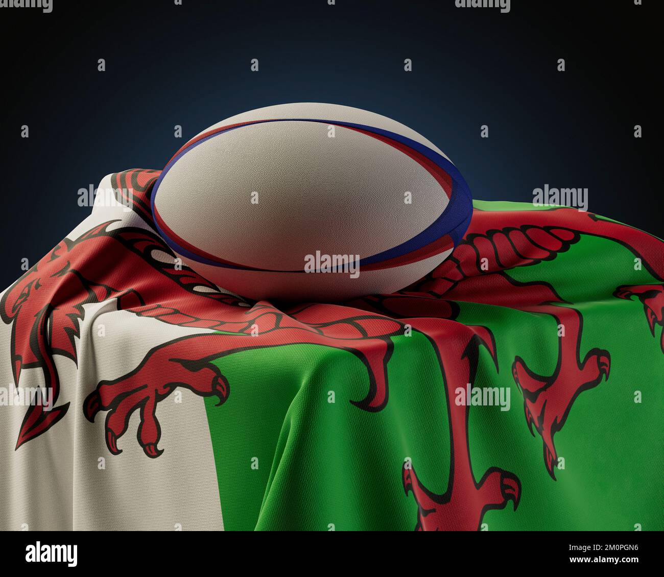 A regular rugby ball resting on a Wales flag draped over a plinth on an ...