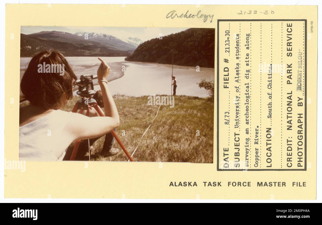 University of Alaska students surveying an archeological dig site along ...