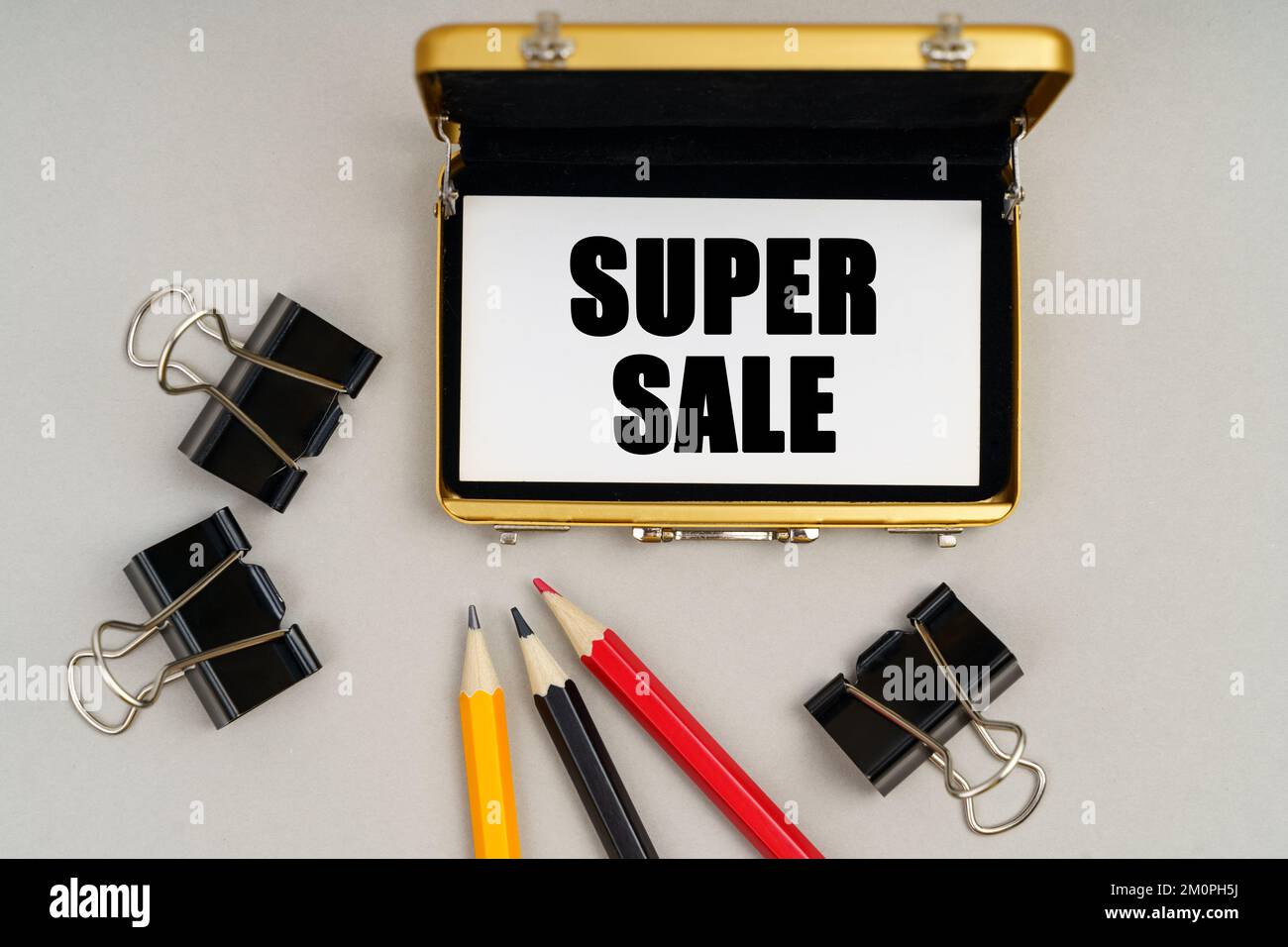 Business concept. On the table are pencils, paper clips and a business ...