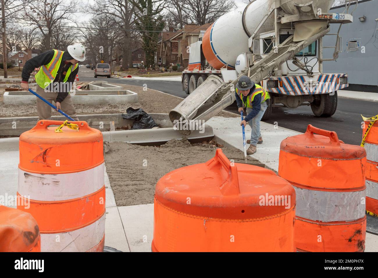 Detroit, Michigan - Workers pour cement for a new sidewalk that is ...