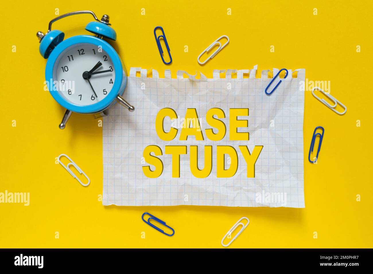 Business and finance concept. On the table lies an alarm clock, paper ...