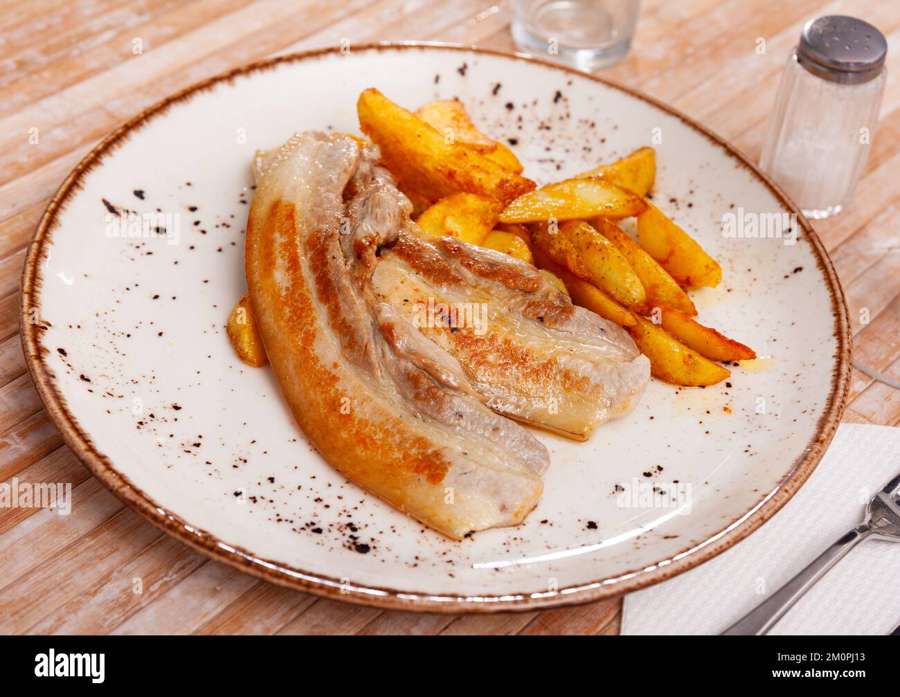 Fried pork belly with potato, homemade dinner Stock Photo - Alamy