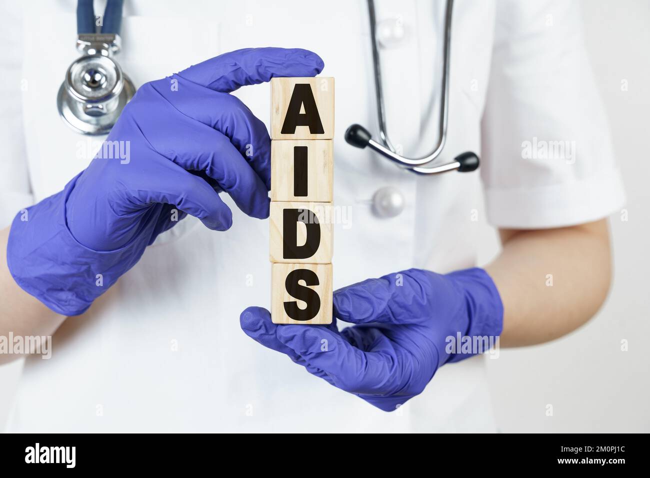 Medicine and health concept. The doctor holds cubes in his hands on ...