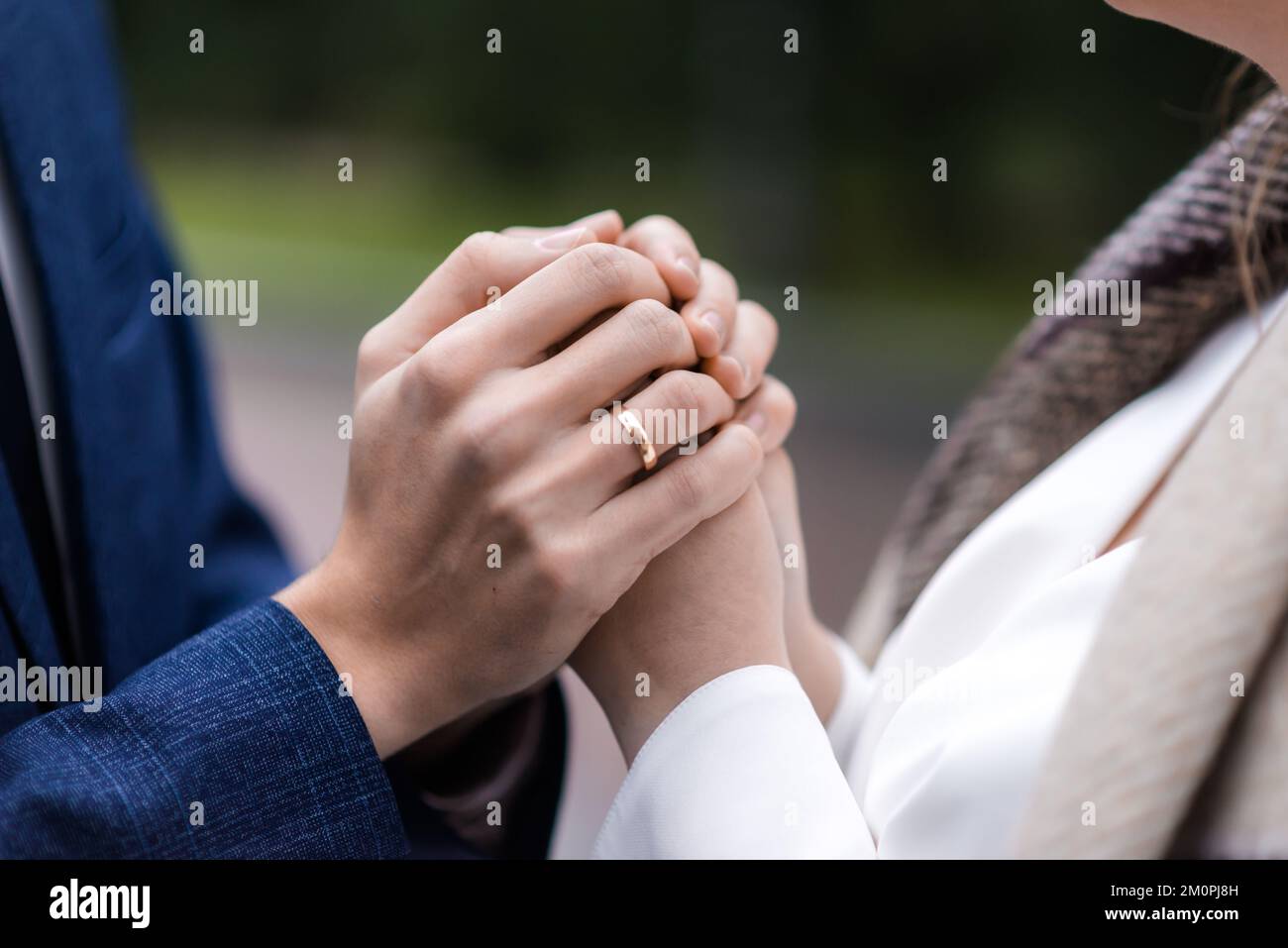 hands of bride and groom with rings. bride and groom in a cafe. wedding ...