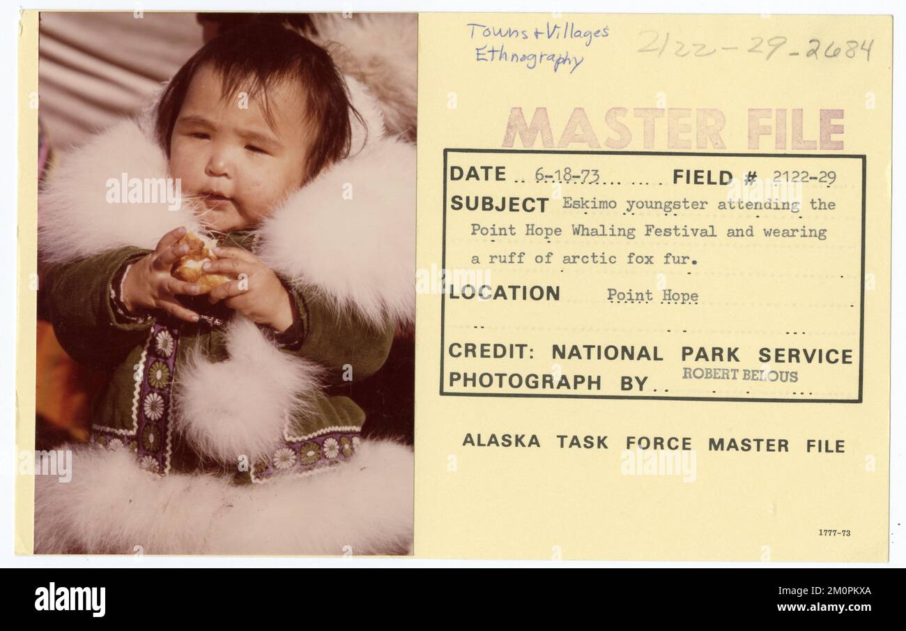 Eskimo youngster attending the Point Hope Whaling Festival and wearing ...