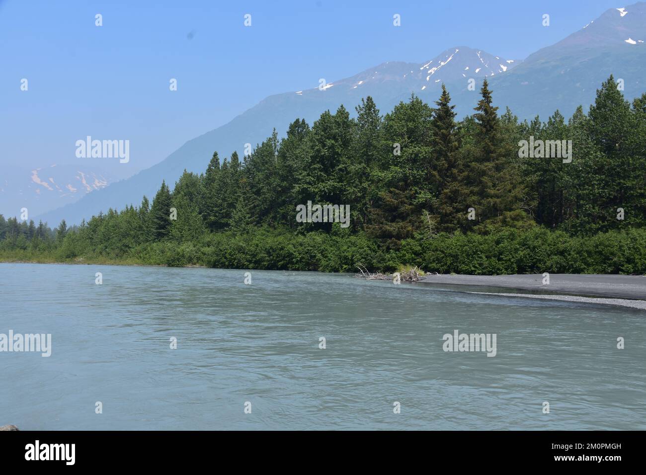 Alpine river with rocky shore Stock Photo - Alamy