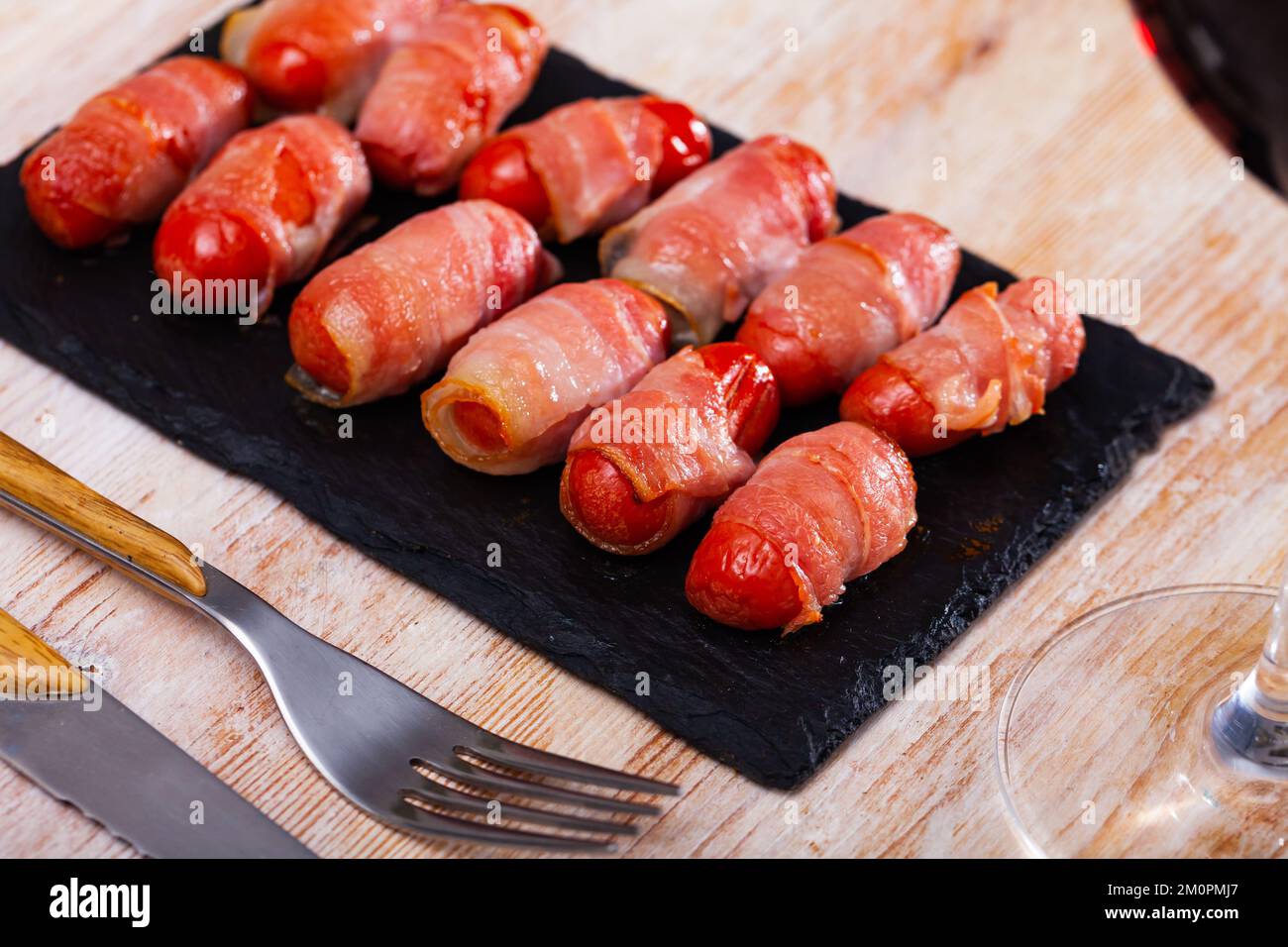 Spanish tasty meal rolled in bacon sausages Stock Photo - Alamy