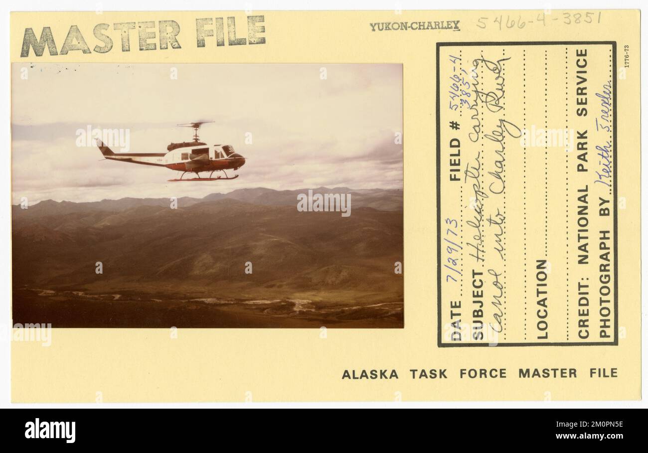 Helicopter carrying canoe into Charley River. Alaska Task Force ...
