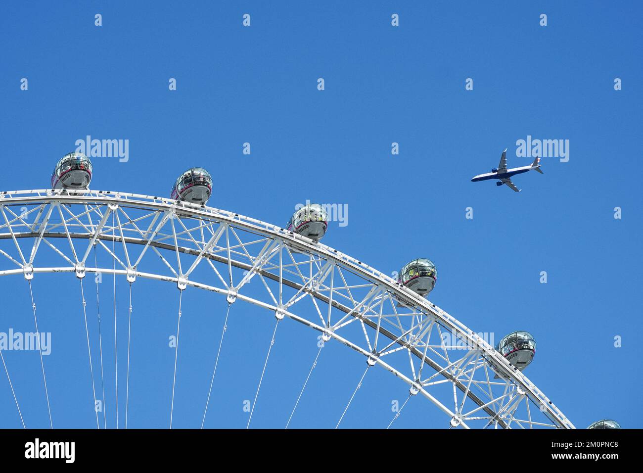 London Eye ferris wheel capsules on clear blue sky, London England ...