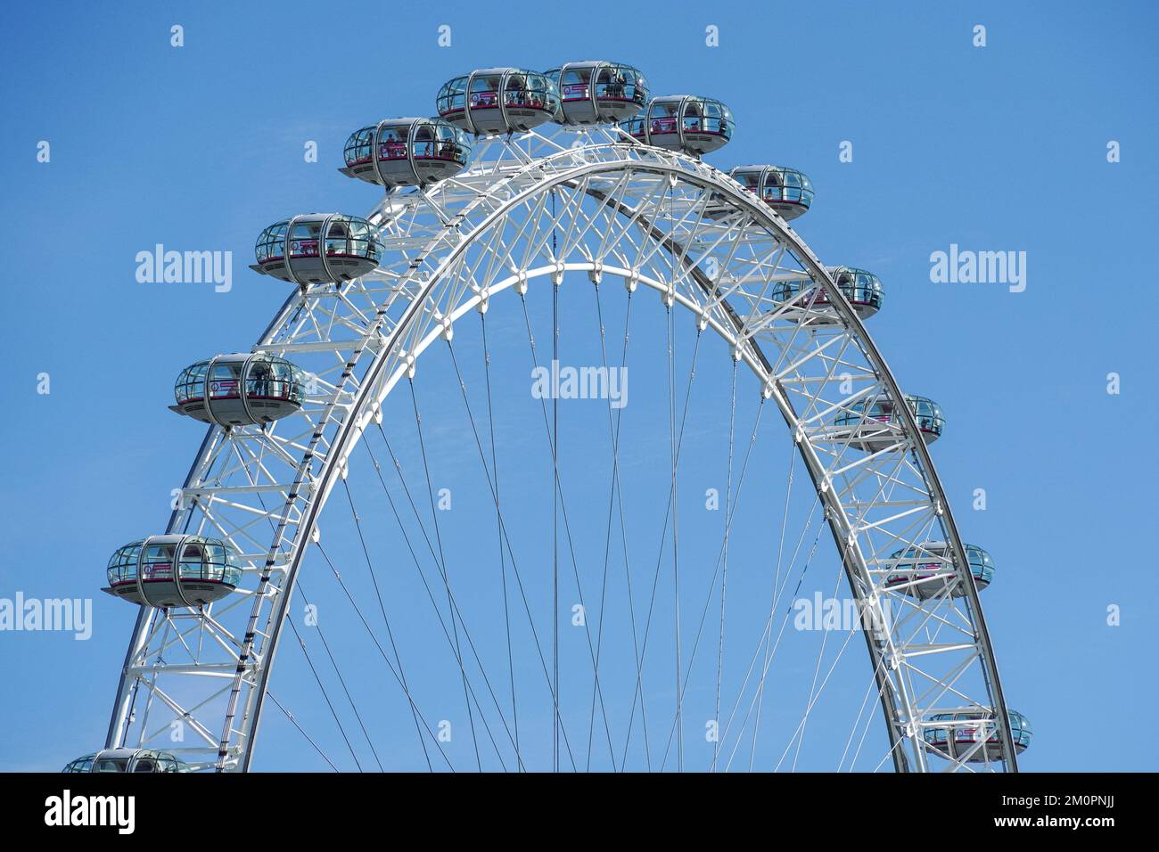 London Eye ferris wheel capsules on clear blue sky, London England ...