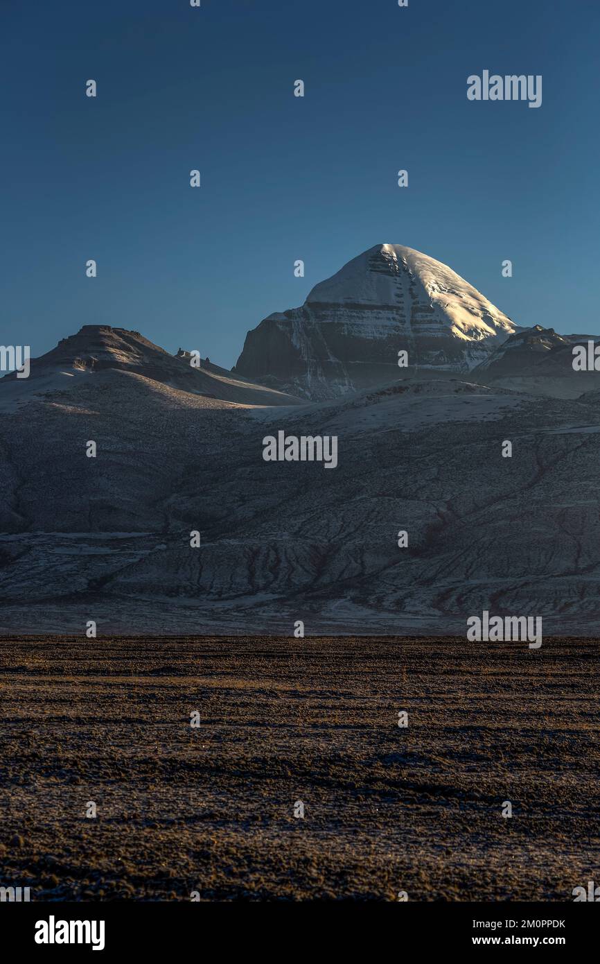 A vertical shot of the snowy Mount Kailash in Taqin County, Ali ...