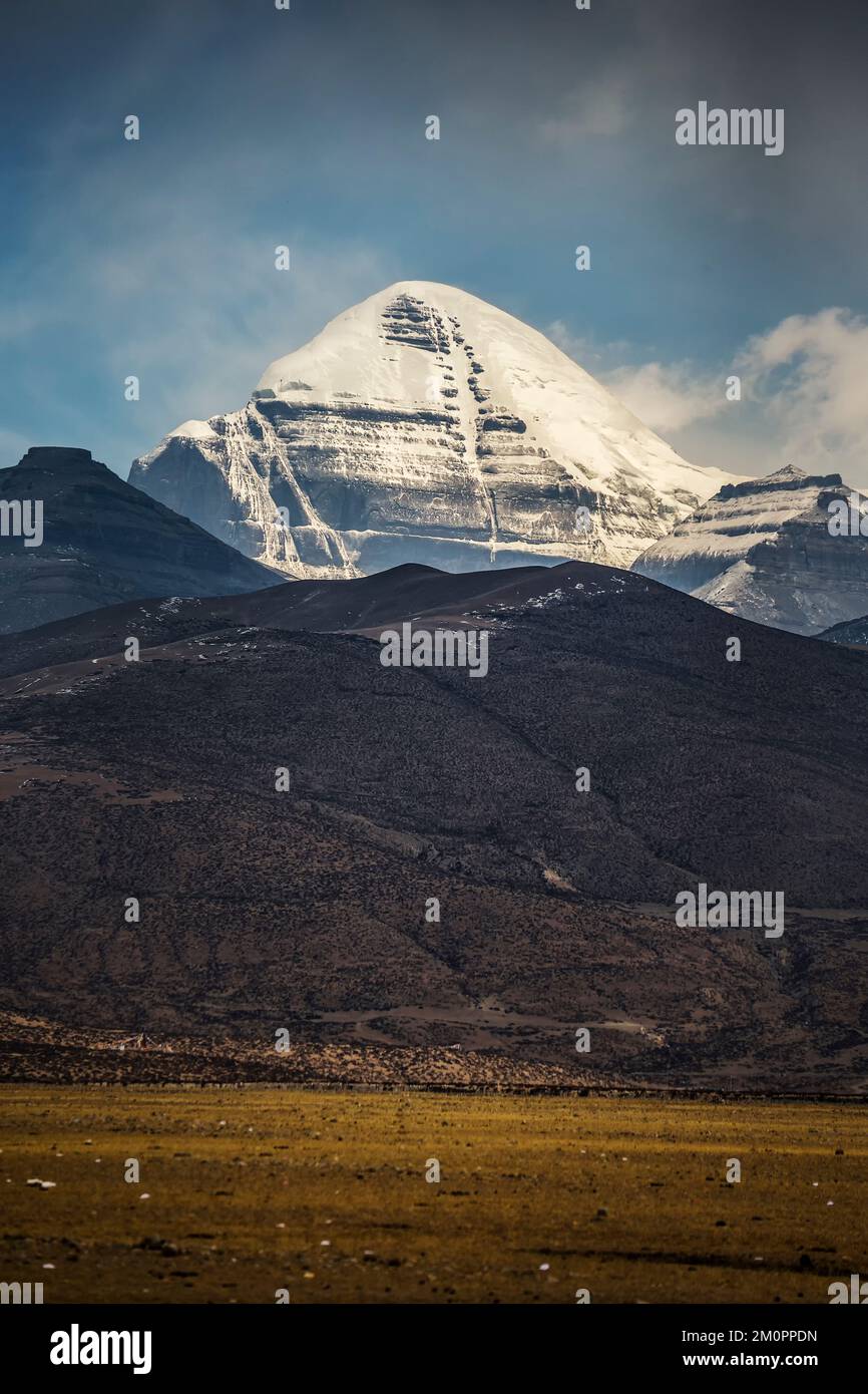 A vertical shot of the snowy Mount Kailash in Taqin County, Ali ...