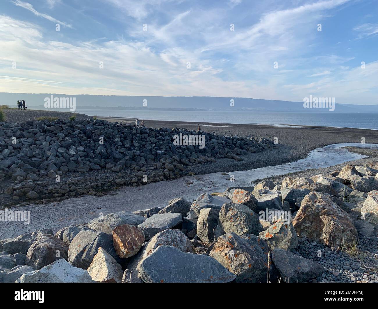 Ocean inlet on a rocky beach Stock Photo - Alamy