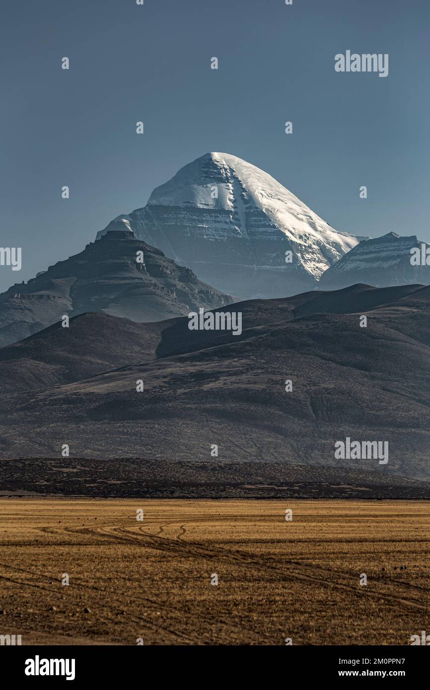 A vertical shot of the snowy Mount Kailash in Taqin County, Ali ...