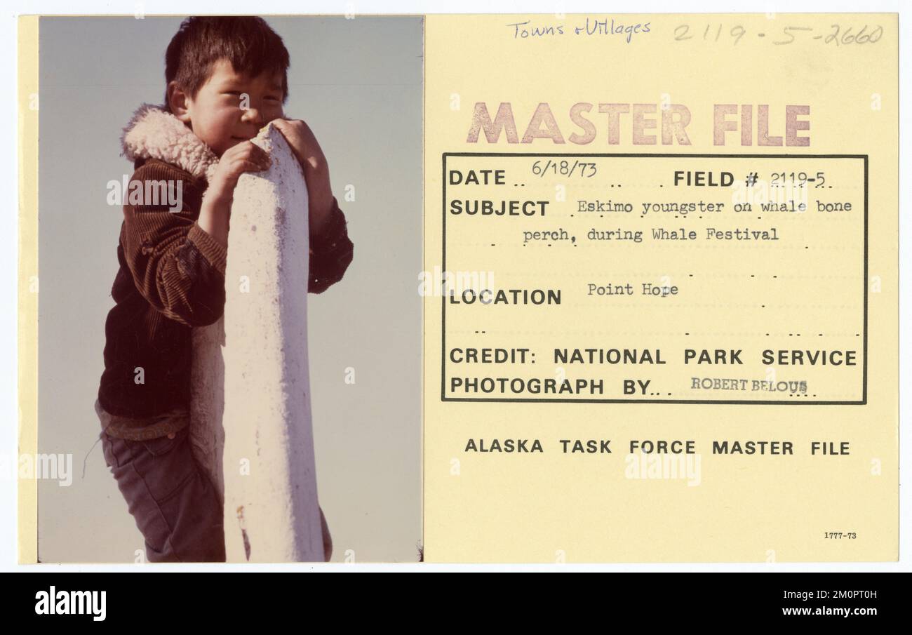 Eskimo youngster on whale bone perch, during Whale Festival. Alaska ...