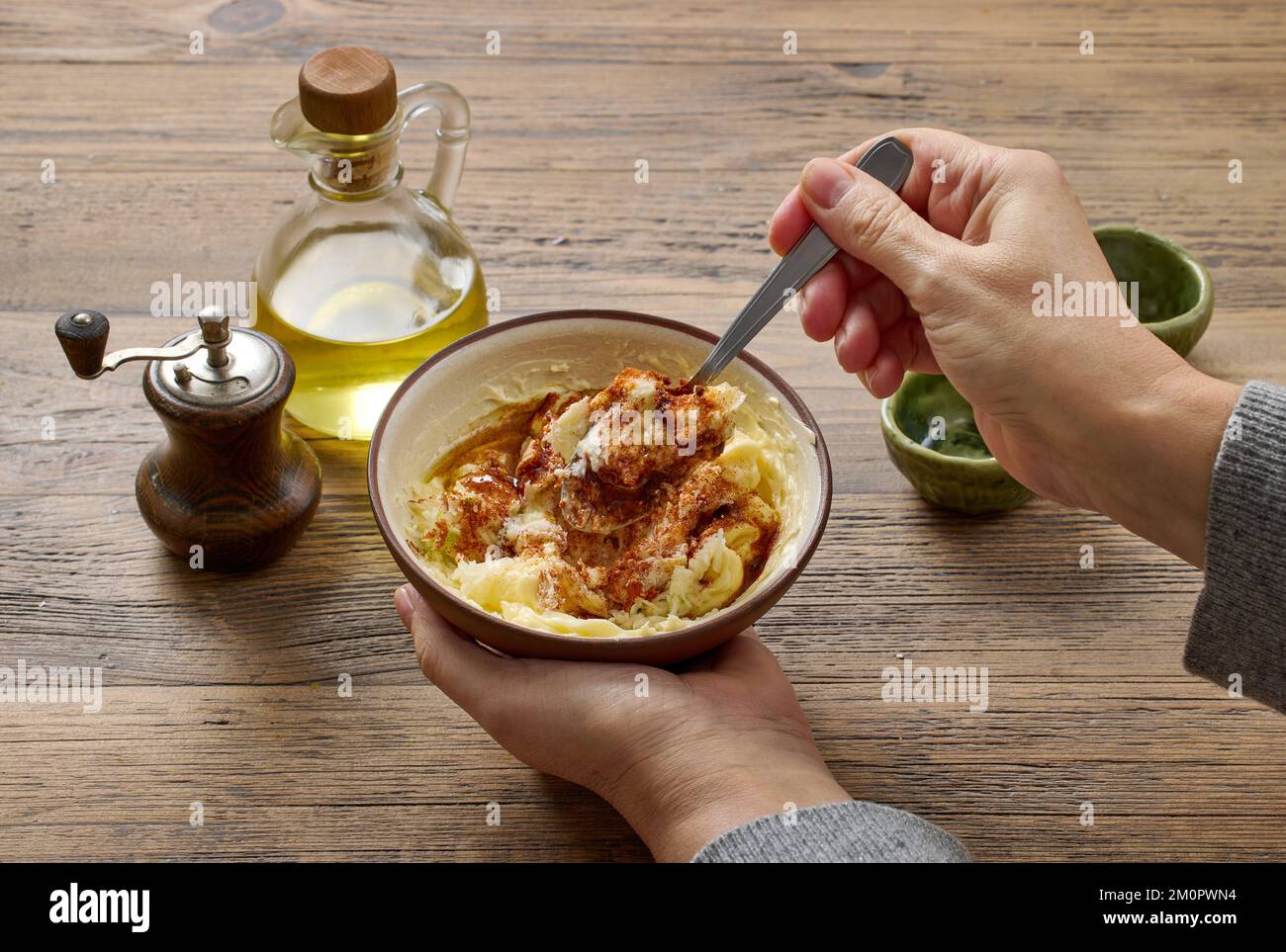 mixing butter with spices. process of making roasted chicken Stock ...