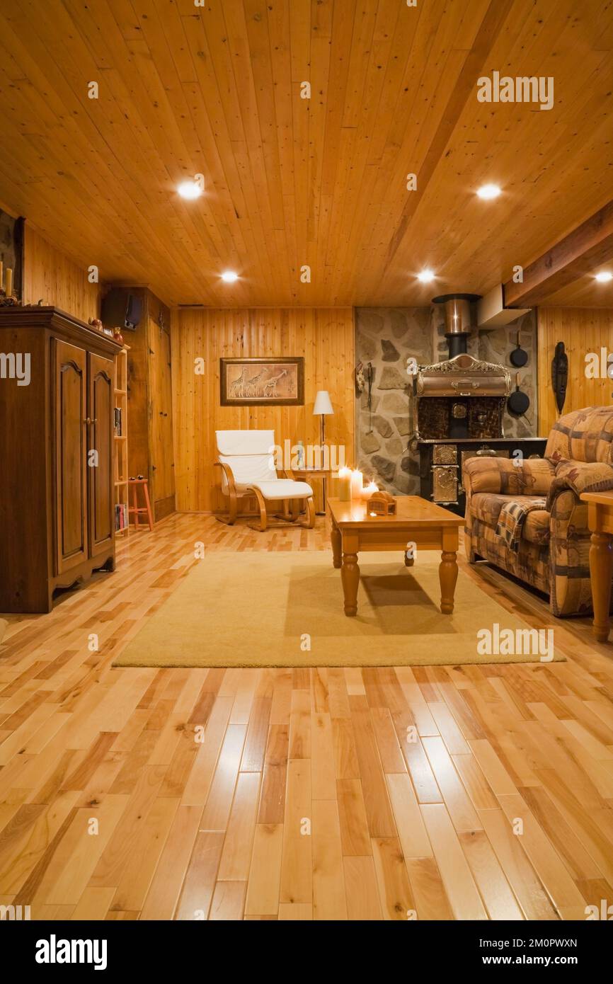 Antique furnishings, sofa and long chair in basement family room inside ...