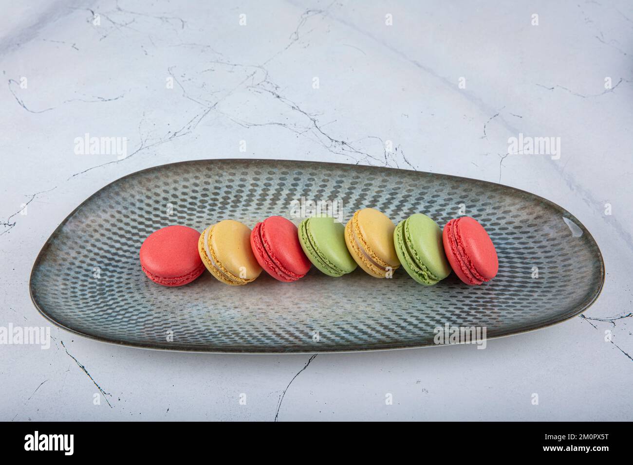 Colorful macarons dessert with vintage pastel tones. Colorful French ...