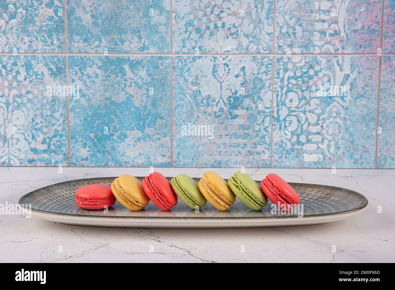 Colorful macarons dessert with vintage pastel tones. Colorful French ...