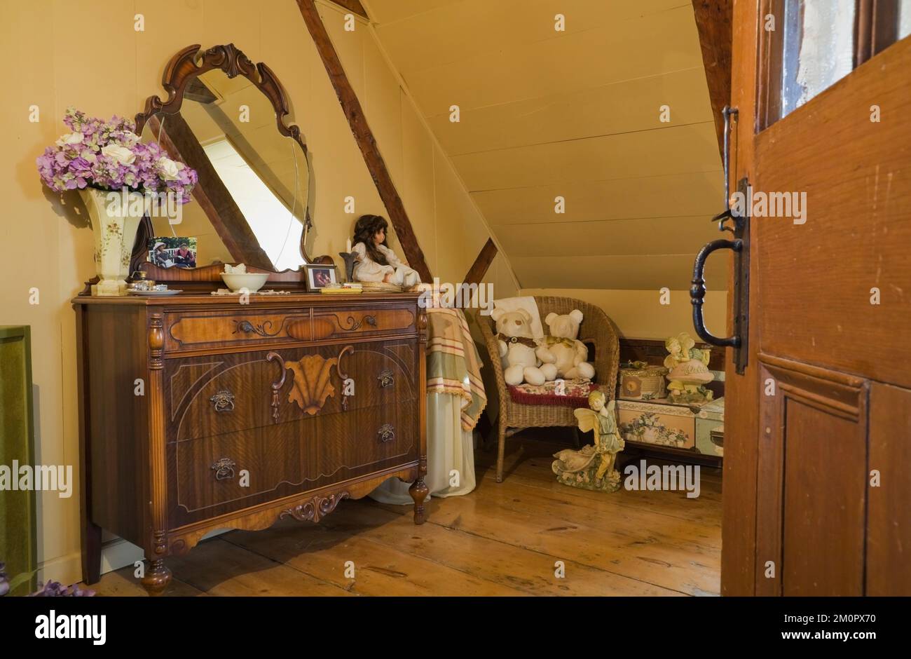 Antique dresser and decorative objects and curios in guest bedroom on ...