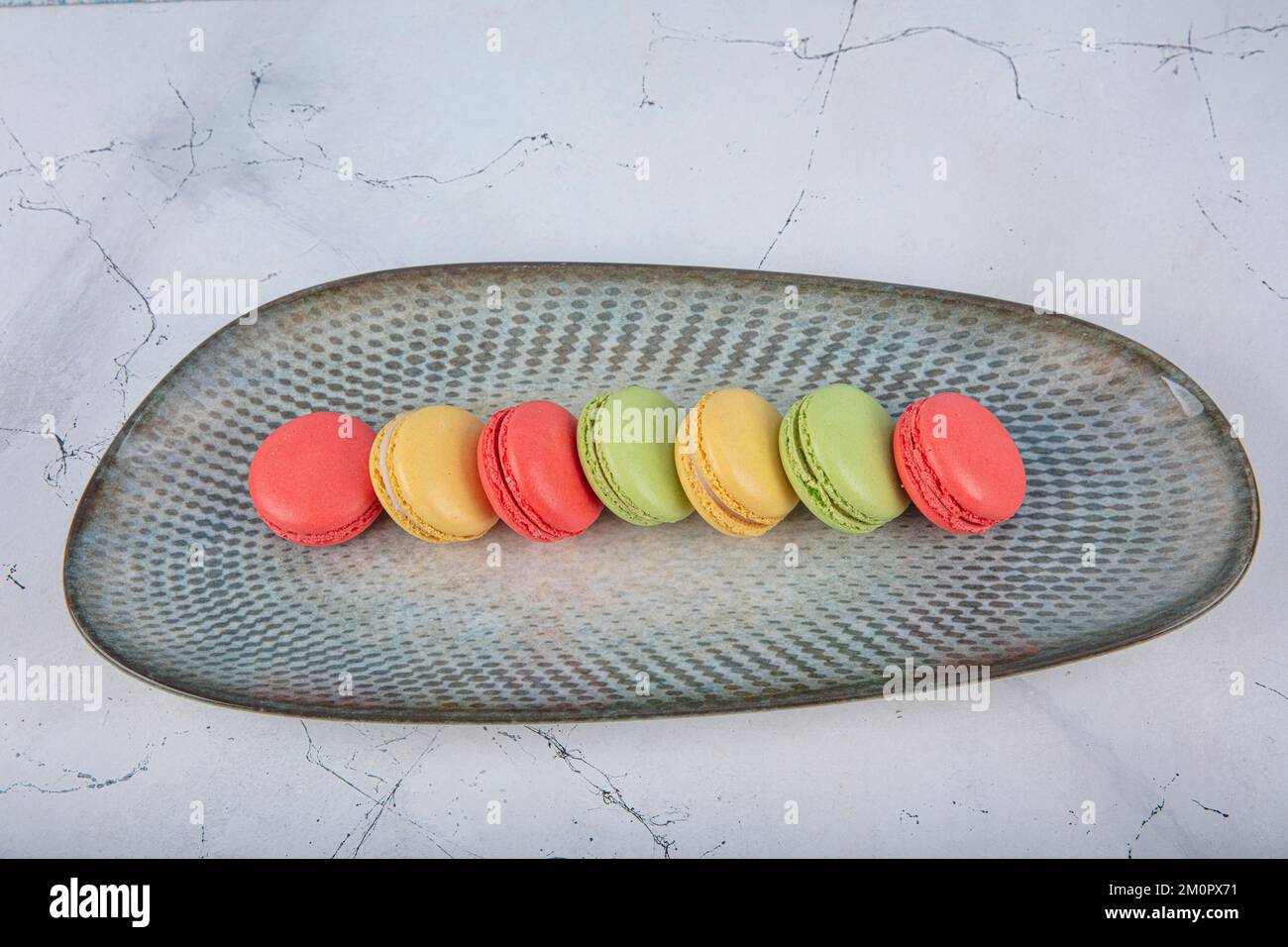 Colorful macarons dessert with vintage pastel tones. Colorful French ...