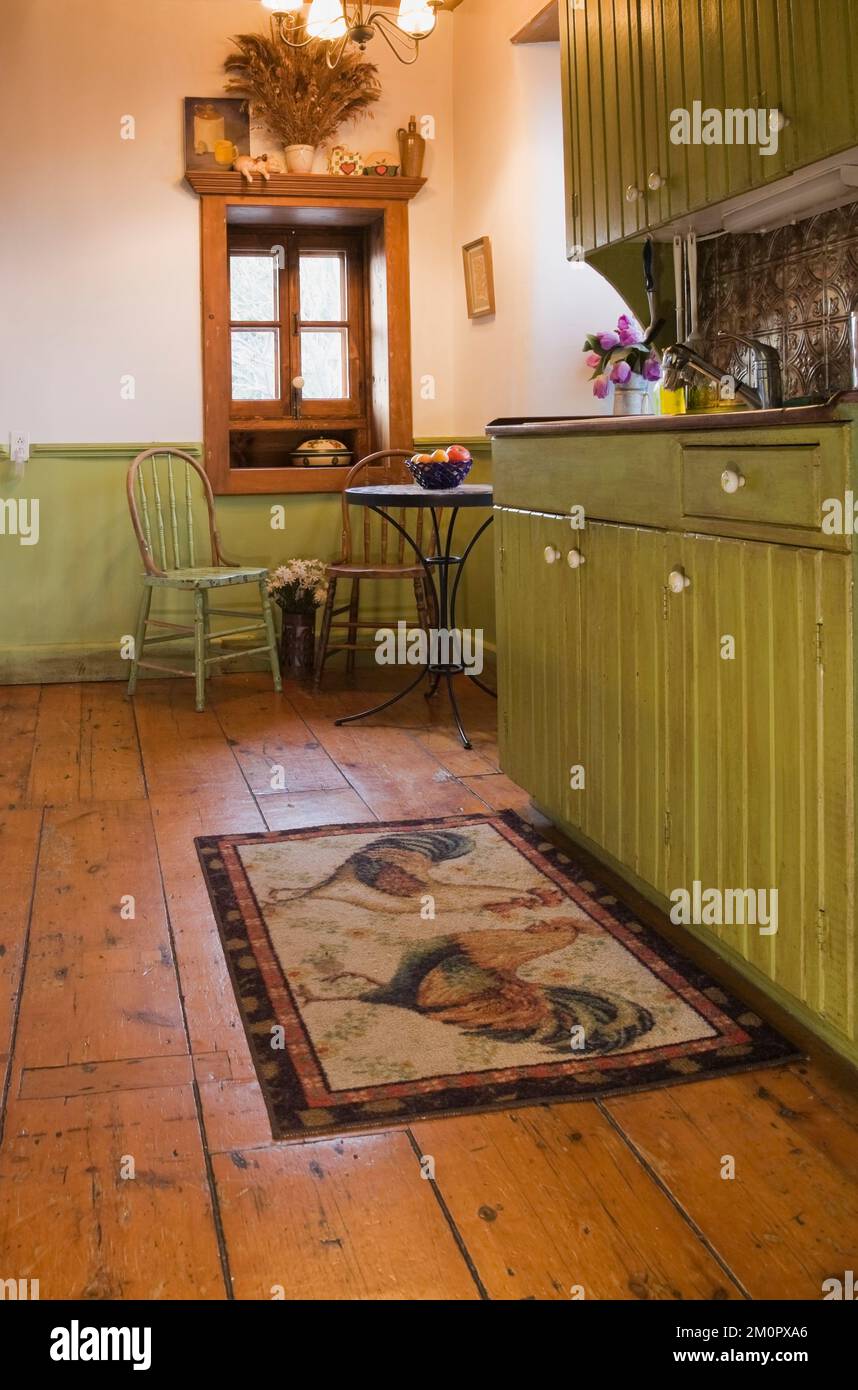 Kitchen room with olive green cabinets inside old 1850 Canadiana ...