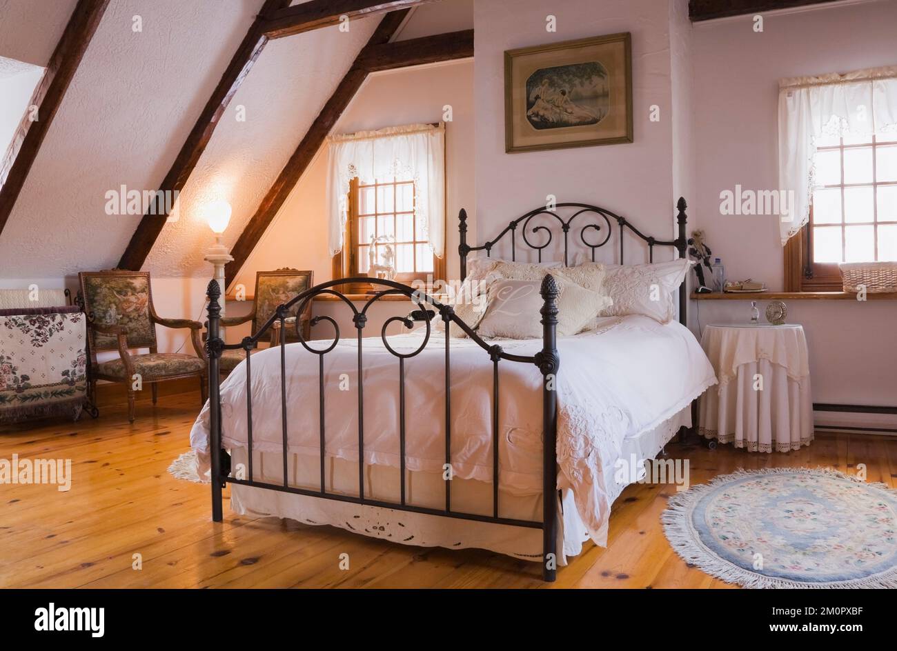 Antique four poster double bed and antique furnishings in master ...