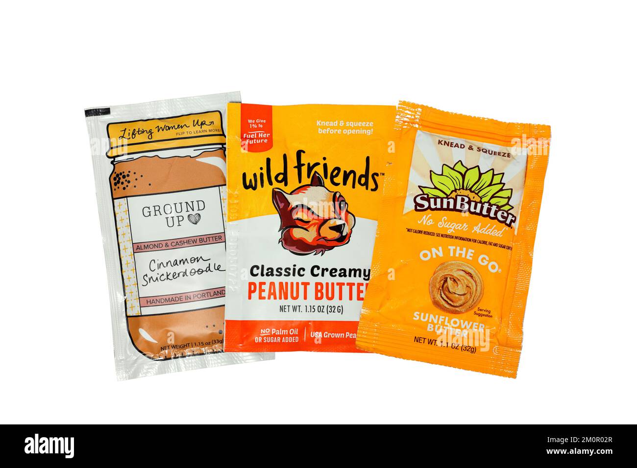 Packets of peanut, sunflower, cashew, and almond nut butters isolated ...