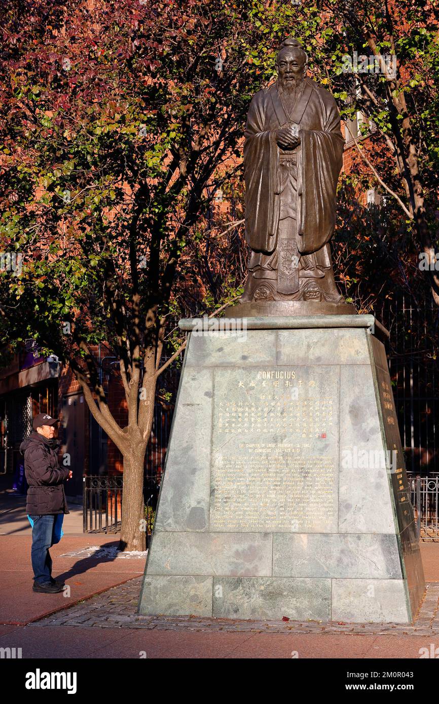 A bronze sculpture of Confucius in Manhattan Chinatown, New York. The ...